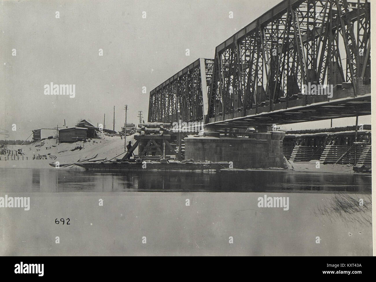 A photograph showing a railway bridge in snow-covered Galicia, likely ...