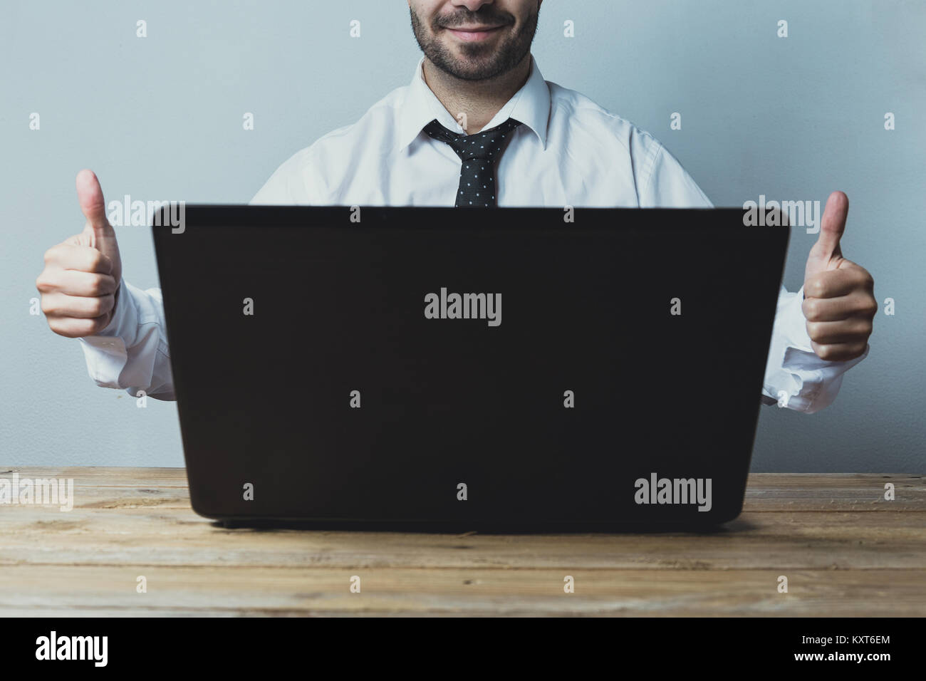 Businessman working computer thumbs up hi-res stock photography and ...