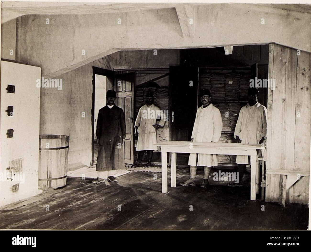 A historical photograph showing a delousing facility with laundry ...