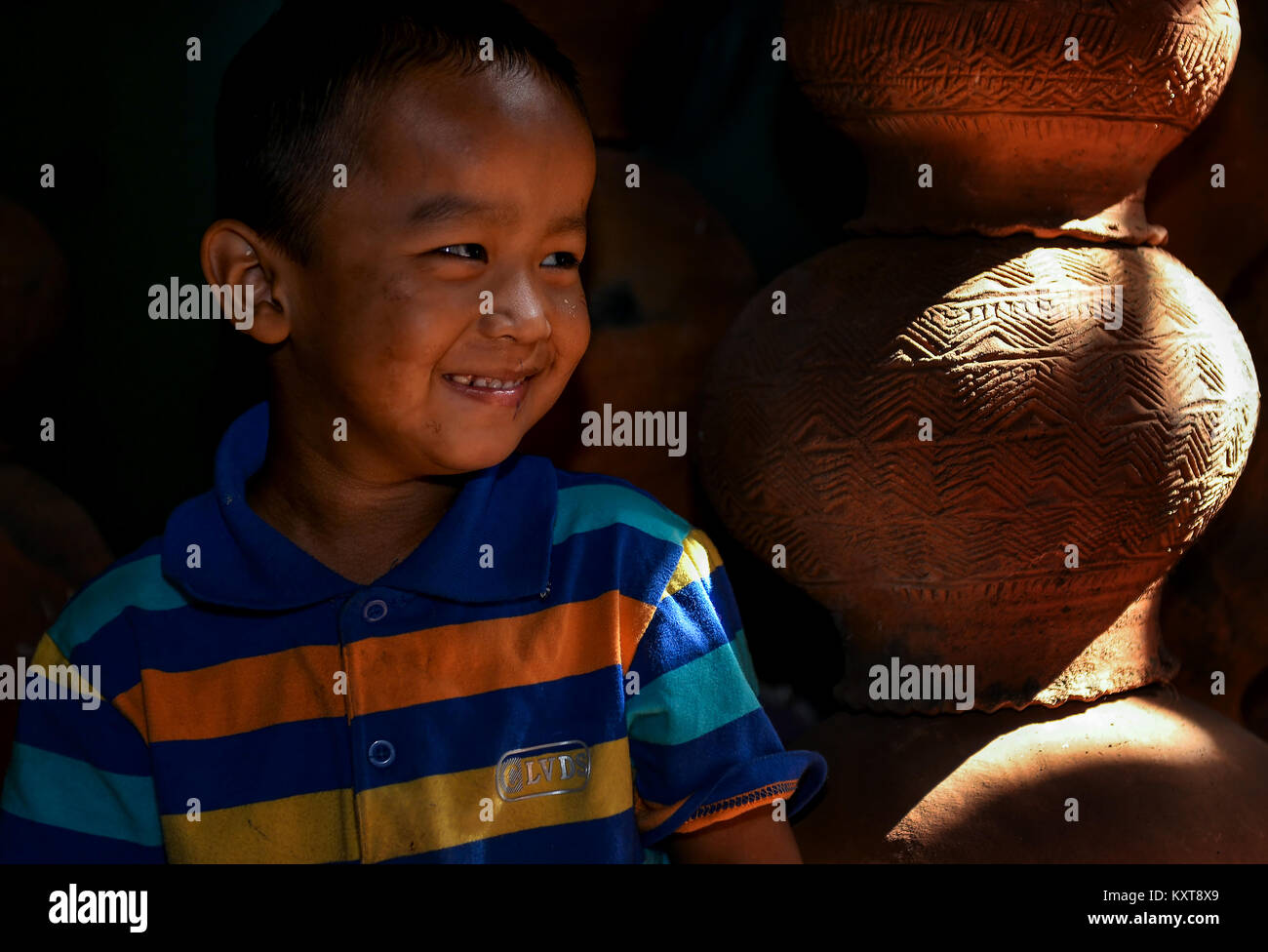 Pot maker son smiling portrait, Bagan, Myanmar Stock Photo - Alamy
