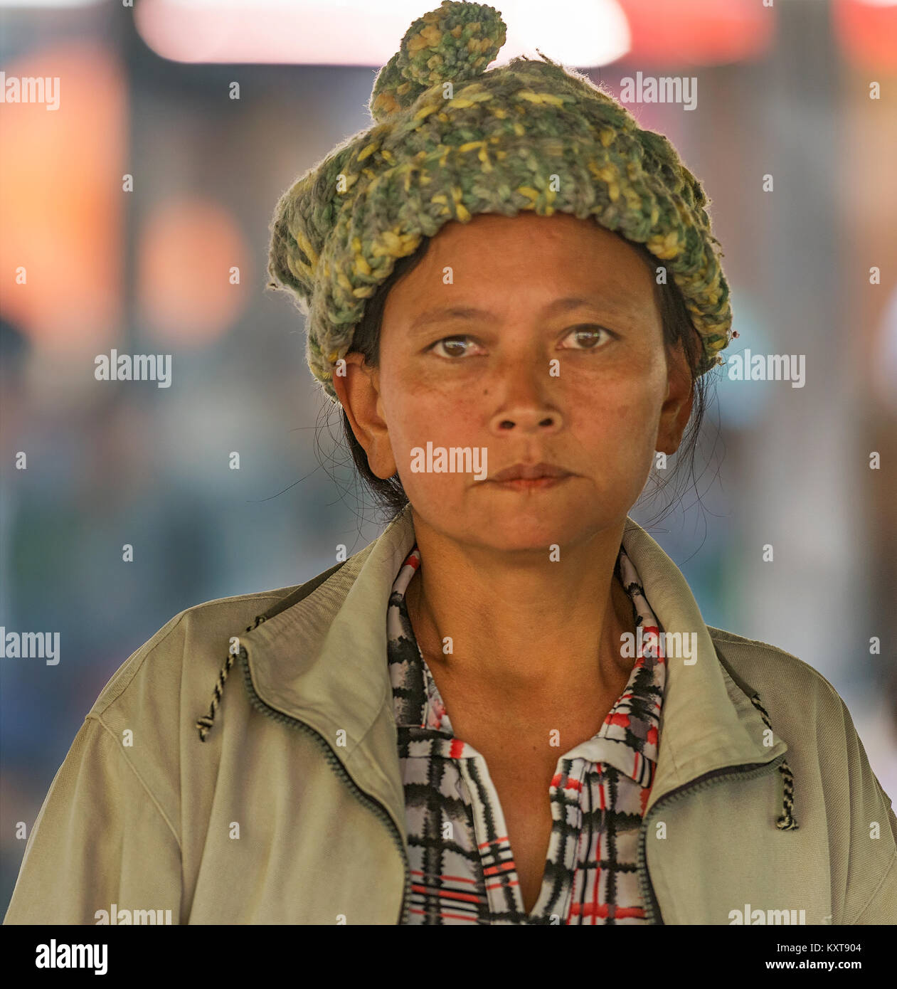 Portrait of local woman in the day time inside local market in Inle ...
