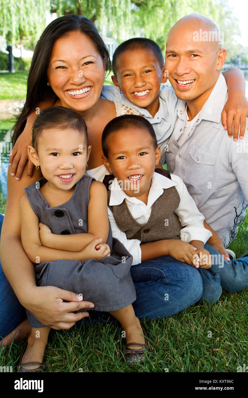 Portrait of a happy Asian family smiling Stock Photo - Alamy