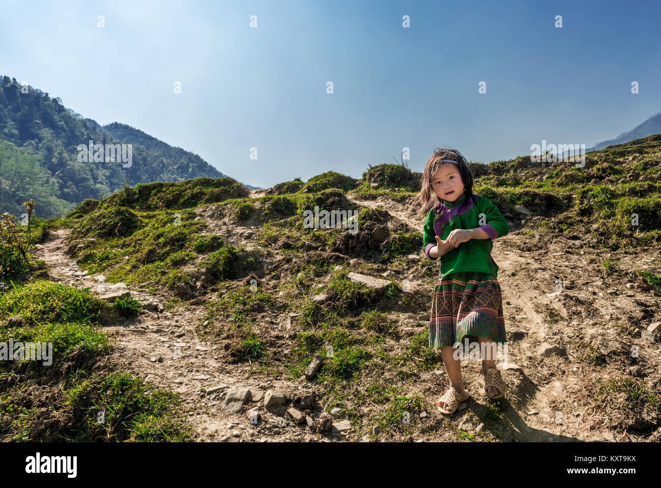Hmong tribe girl walking in Sapa village mountain, Vietnam Stock Photo ...