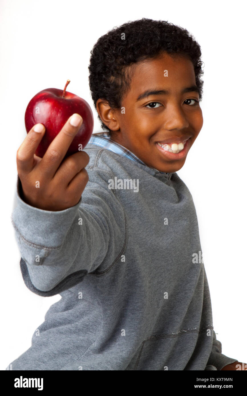 Young kid eating an apple Stock Photo - Alamy