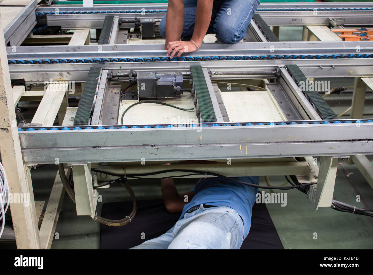 The technician repairing conveyor belt in factory Stock Photo - Alamy