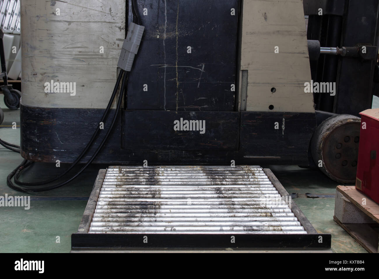 The roller for support battery electric forklift Stock Photo - Alamy