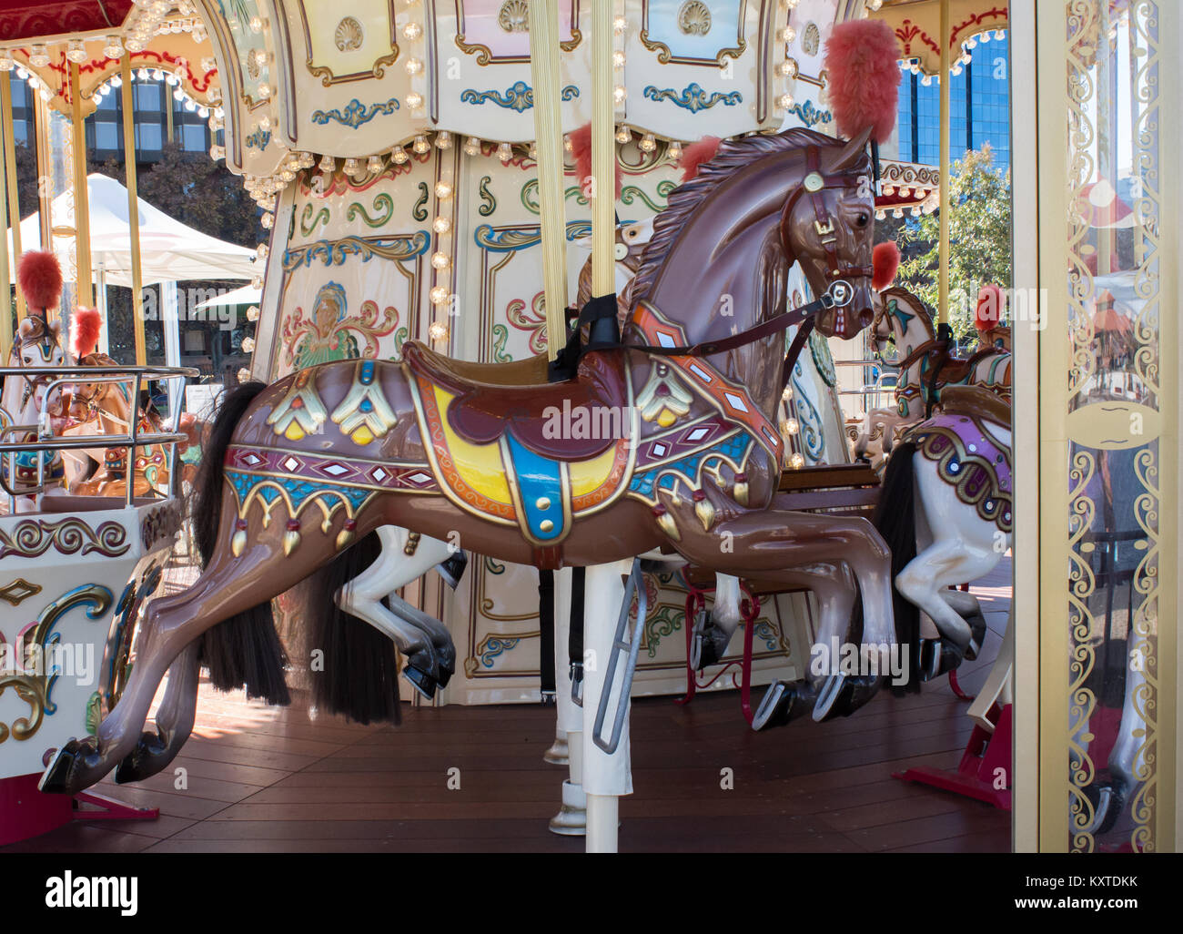 Brown vintage decorative carnival horse on merry go round carousel in ...