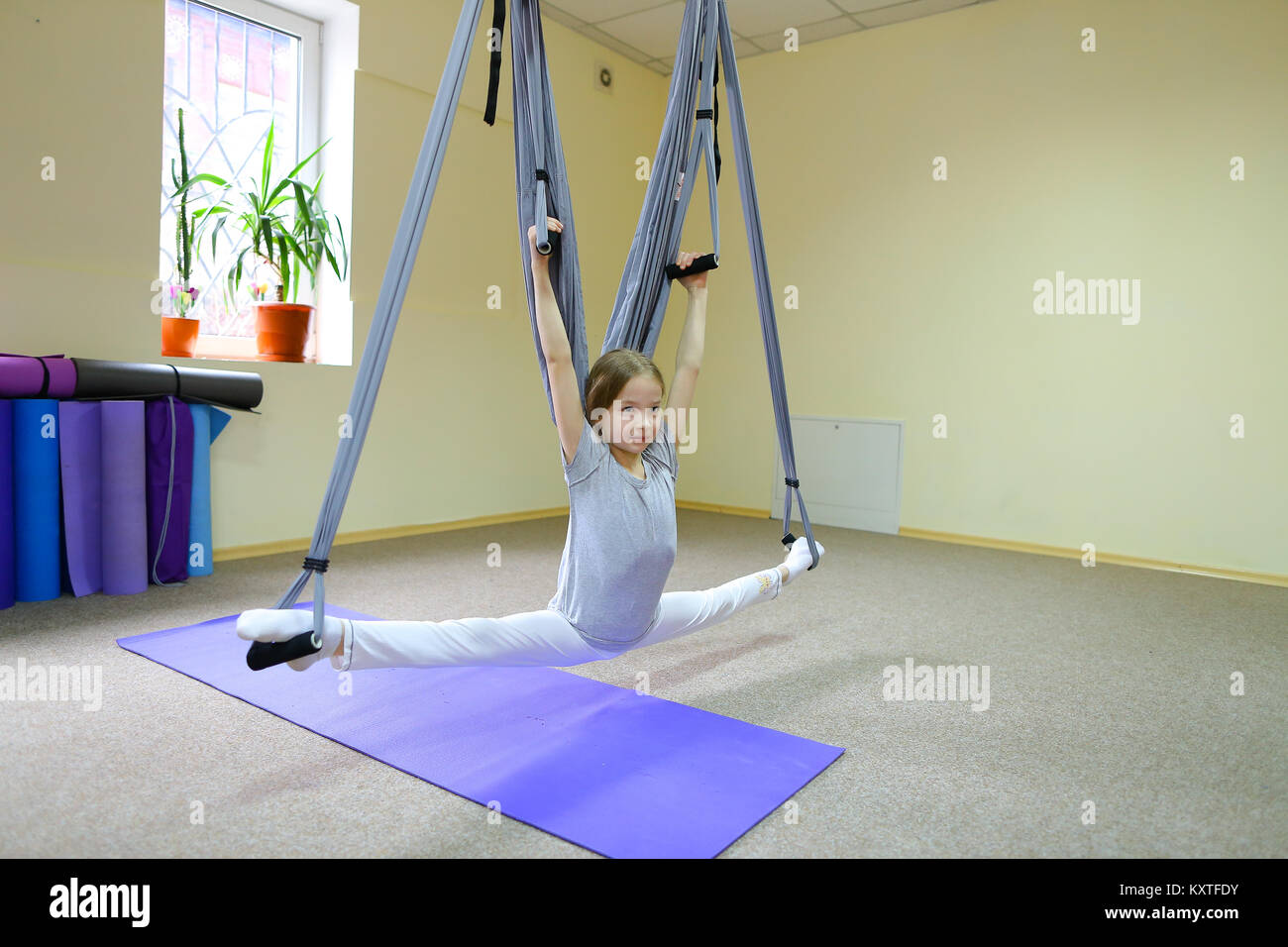 Little girl performs in air acrobatic elements Stock Photo - Alamy