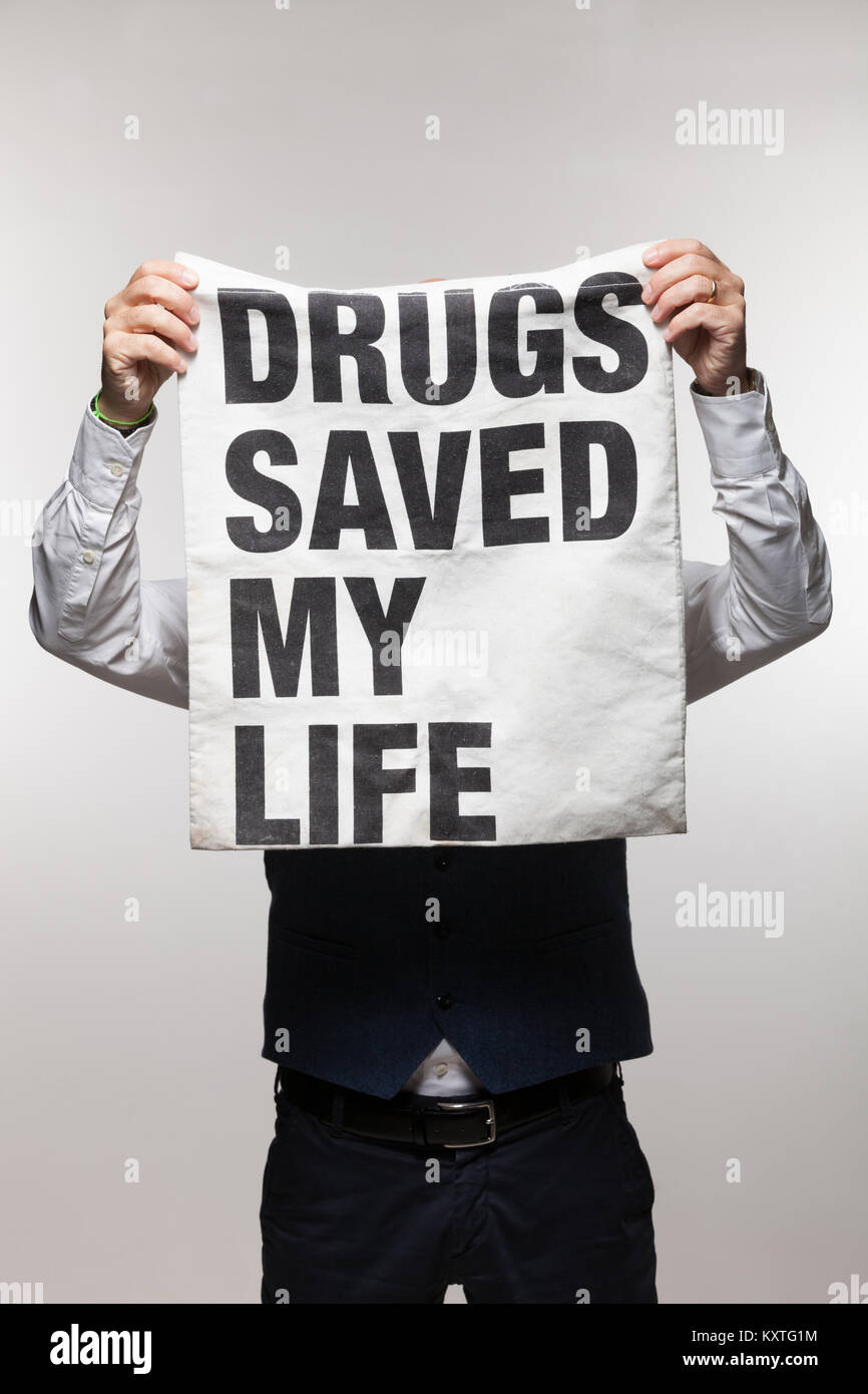 man shows a bag with slogan, studio portrait Stock Photo - Alamy