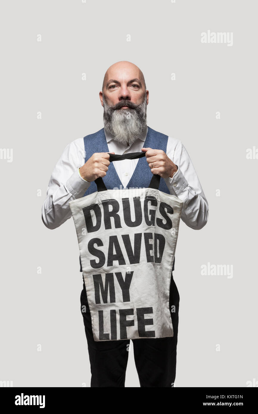 man shows poster with the slogan, portrait in studio Stock Photo - Alamy