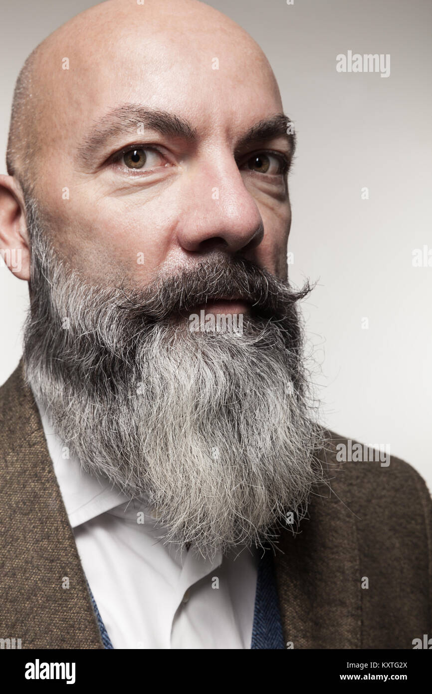 middle-aged man with beard, studio portrait Stock Photo - Alamy