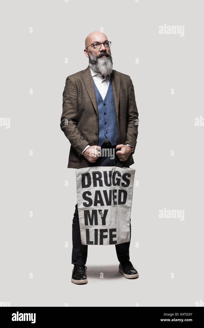 man shows poster with a slogan, isolated on gray background Stock Photo ...