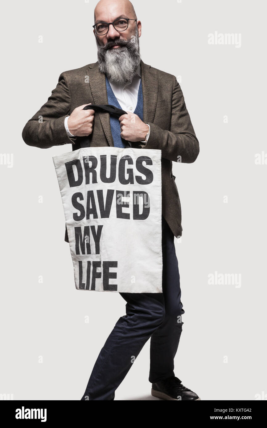 man shows poster with a slogan, isolated on gray background Stock Photo ...