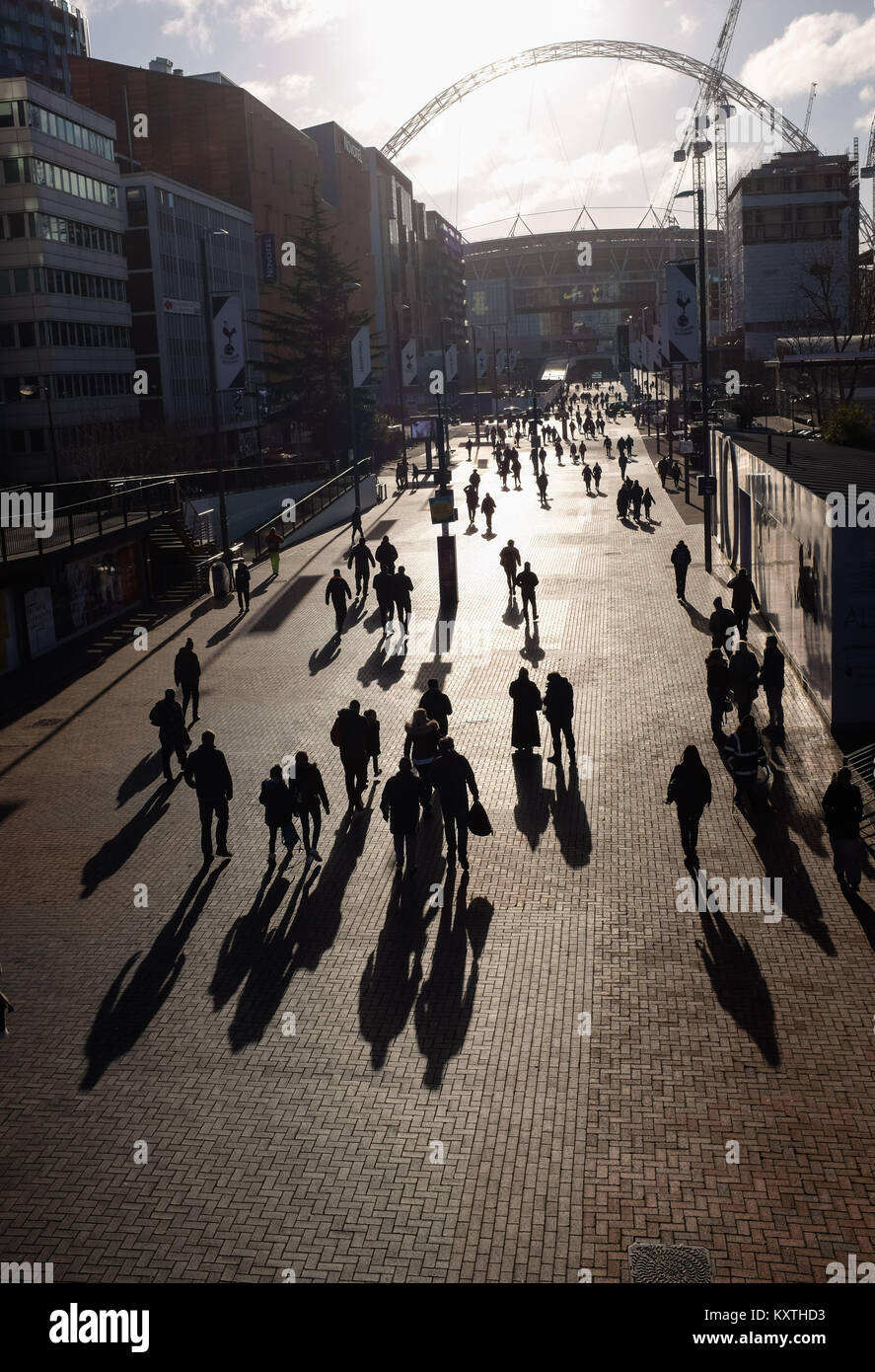 People walking with dark shadows along Wembley Way towards Wembley ...