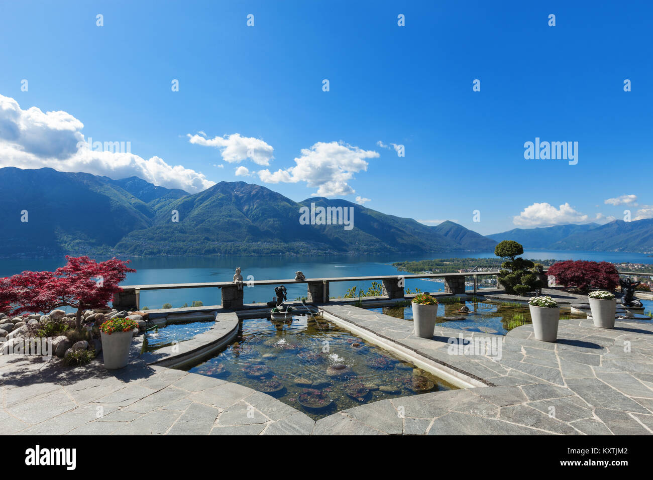 Terrace of a villa with ornamental garden, lake view Stock Photo - Alamy