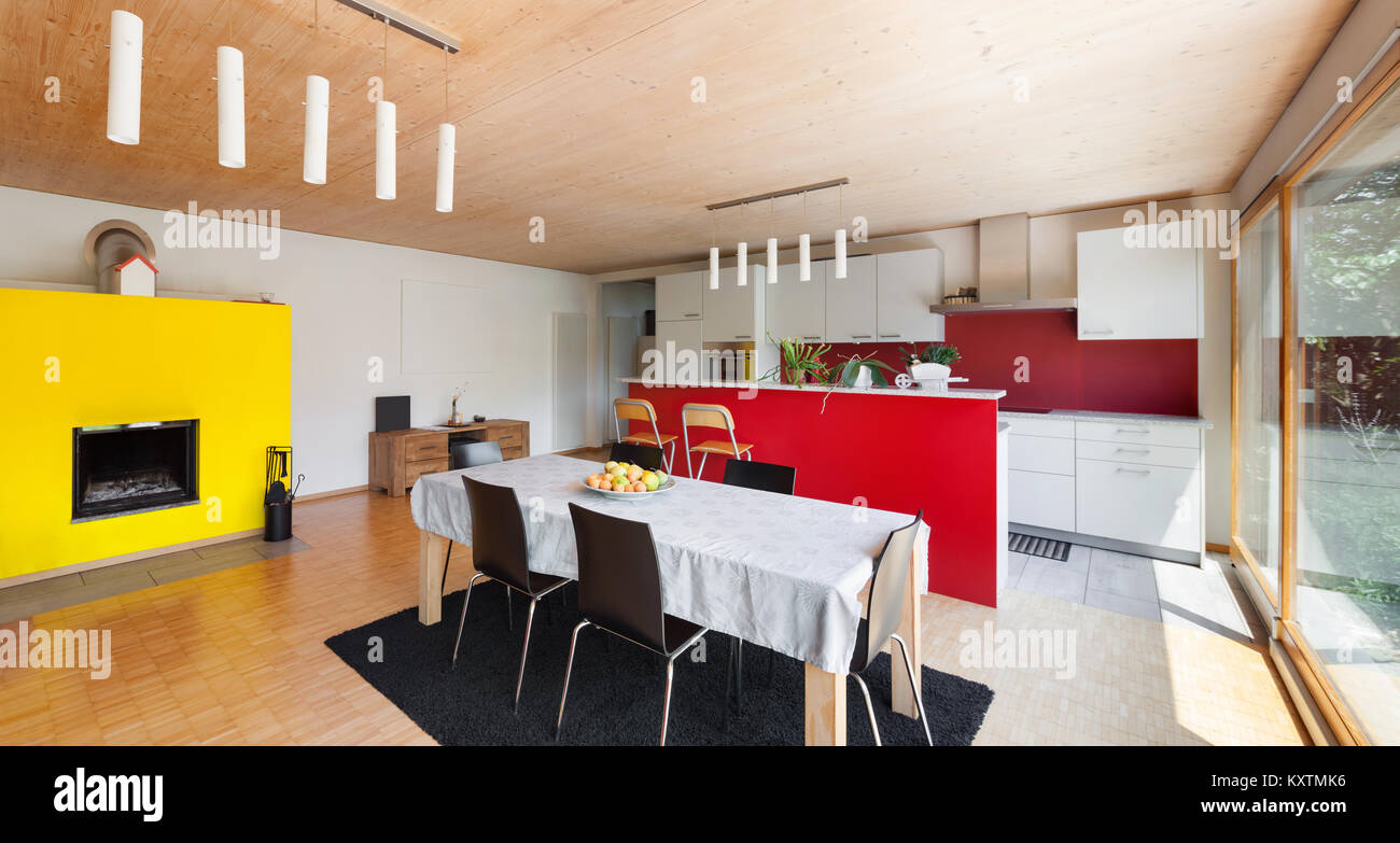Interior of an eco house, modern kitchen and dining table Stock Photo ...