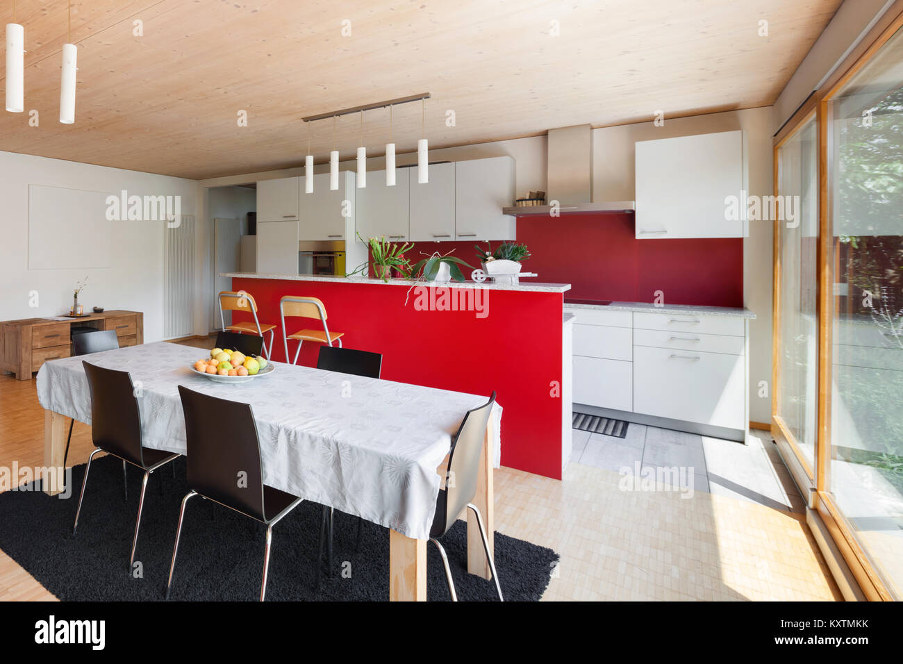 Interior of an eco house, modern kitchen and dining table Stock Photo ...