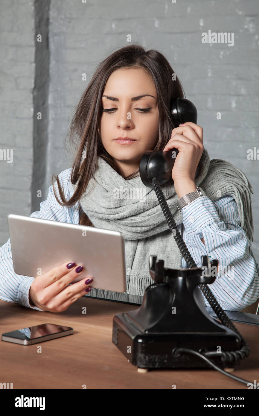 sick business woman is watching something on the tablet and talking on ...