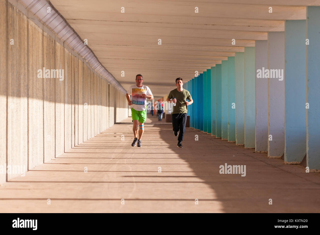 Two men out for a run along the local landmark bottle alley by Sidney ...