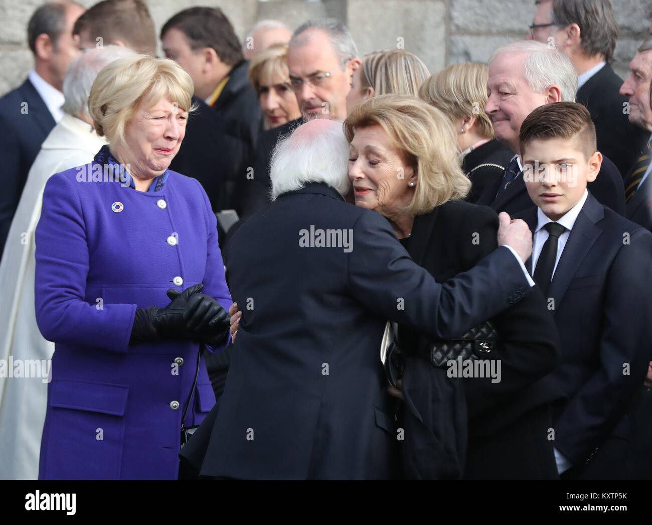President Michael D Higgins comforts Maruja Sutherland, widow of former ...