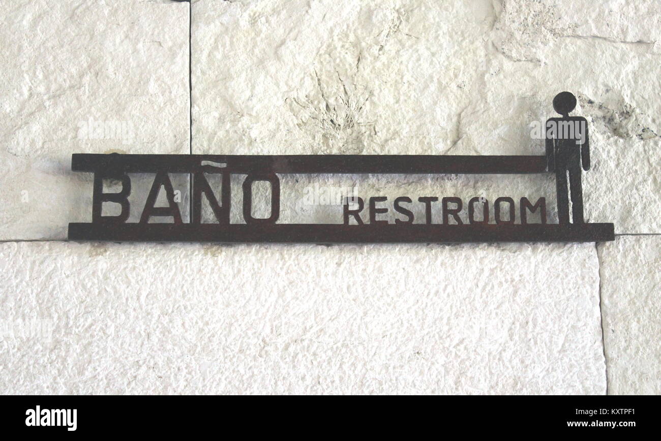 Bi-lingual sign indicating men's restroom at resort in Puerto Vallarta ...