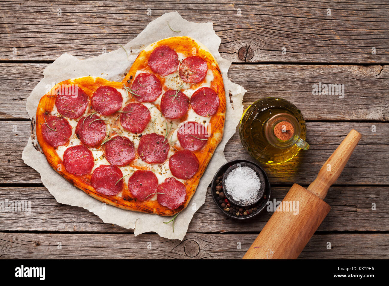 Heart shaped pizza with pepperoni and mozzarella. Valentines day ...