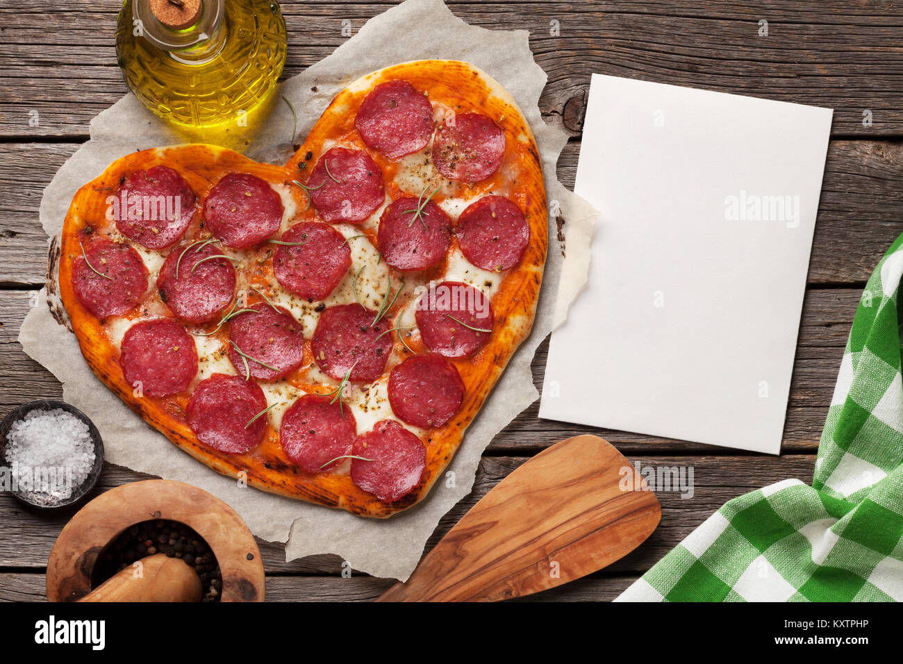 Heart shaped pizza with pepperoni and mozzarella. Valentines day ...