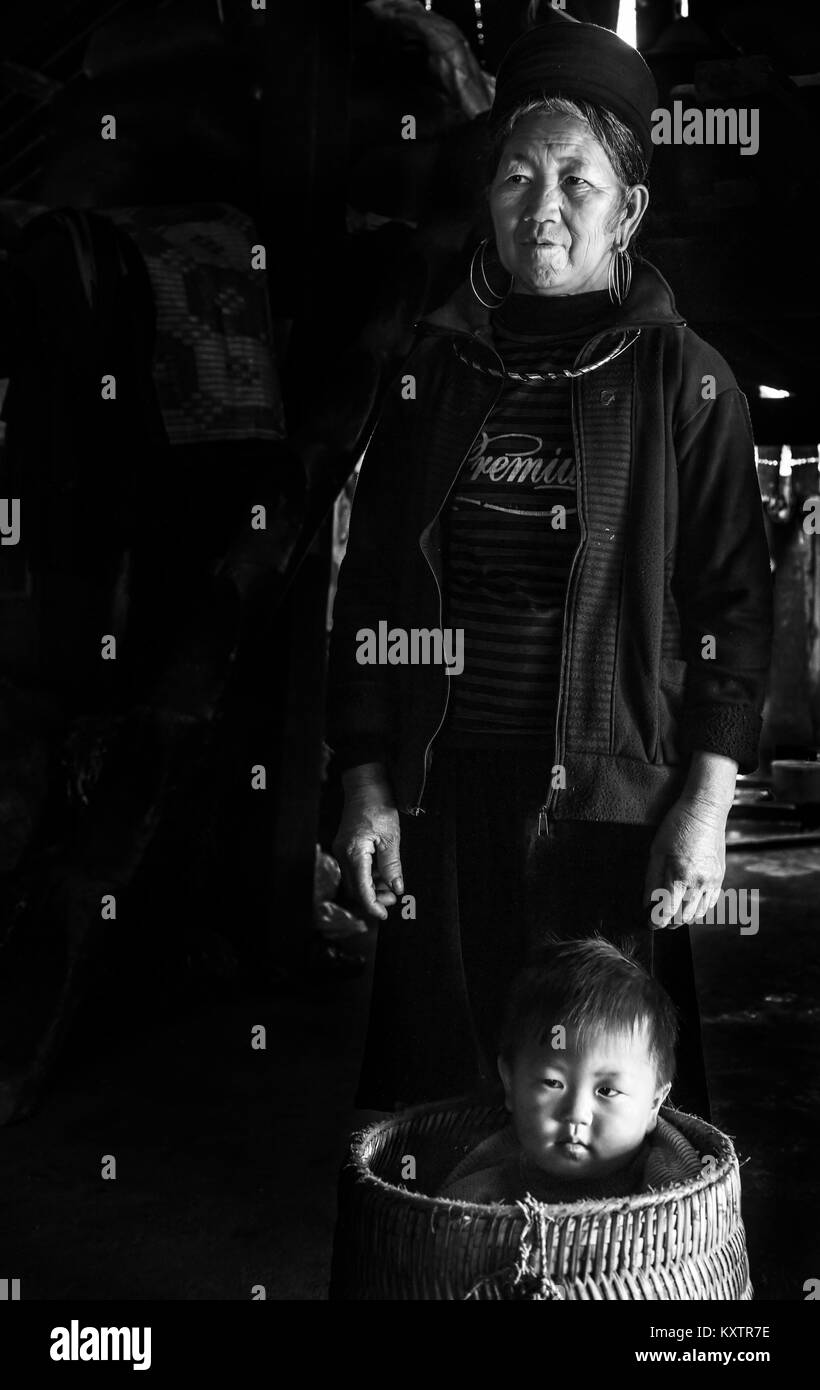 Hmong tribe old woman and her grandson in their village, Sapa, Vietnam ...