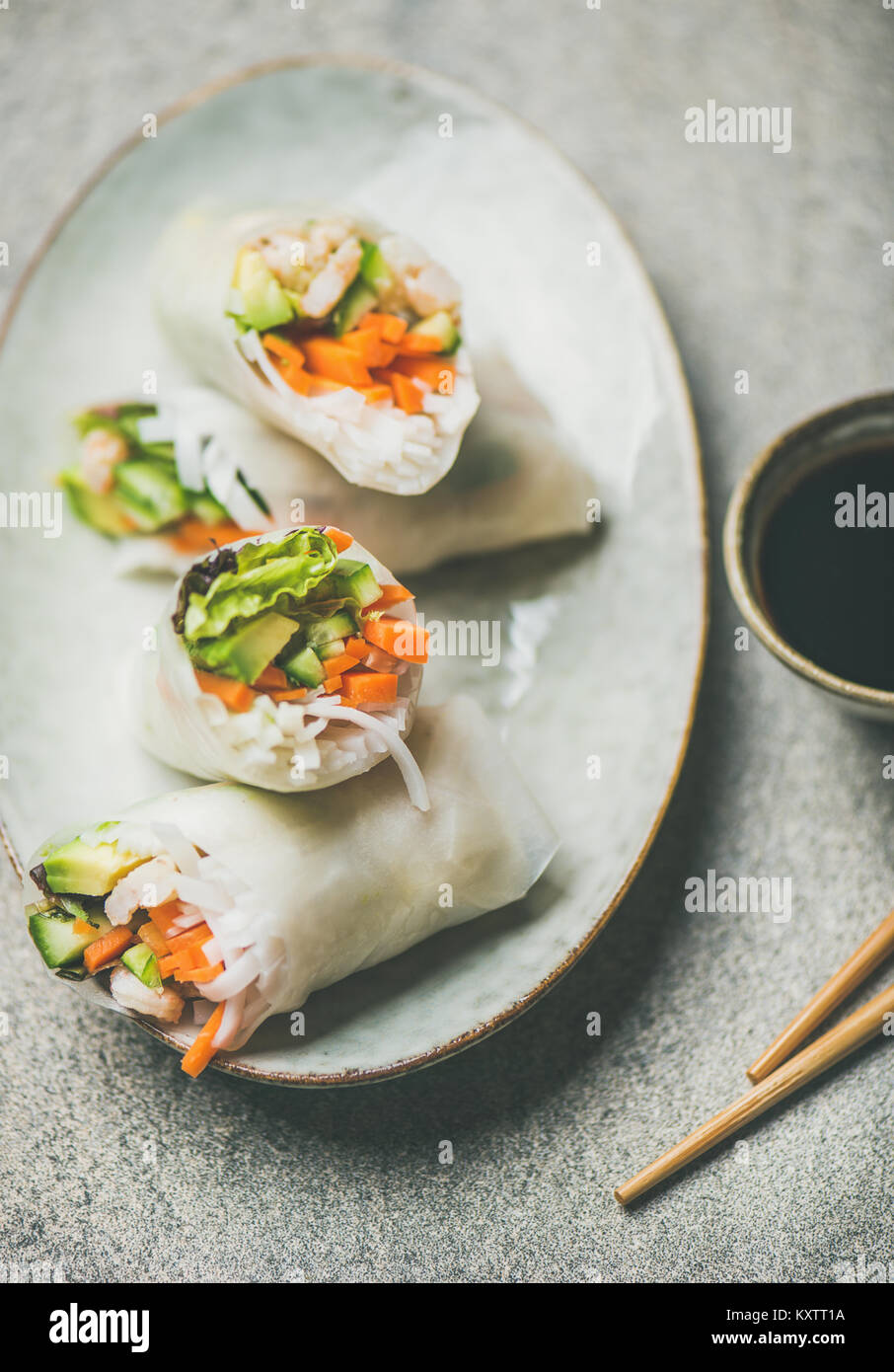 Rice paper spring rolls with sauce and chopsticks, top view Stock Photo ...