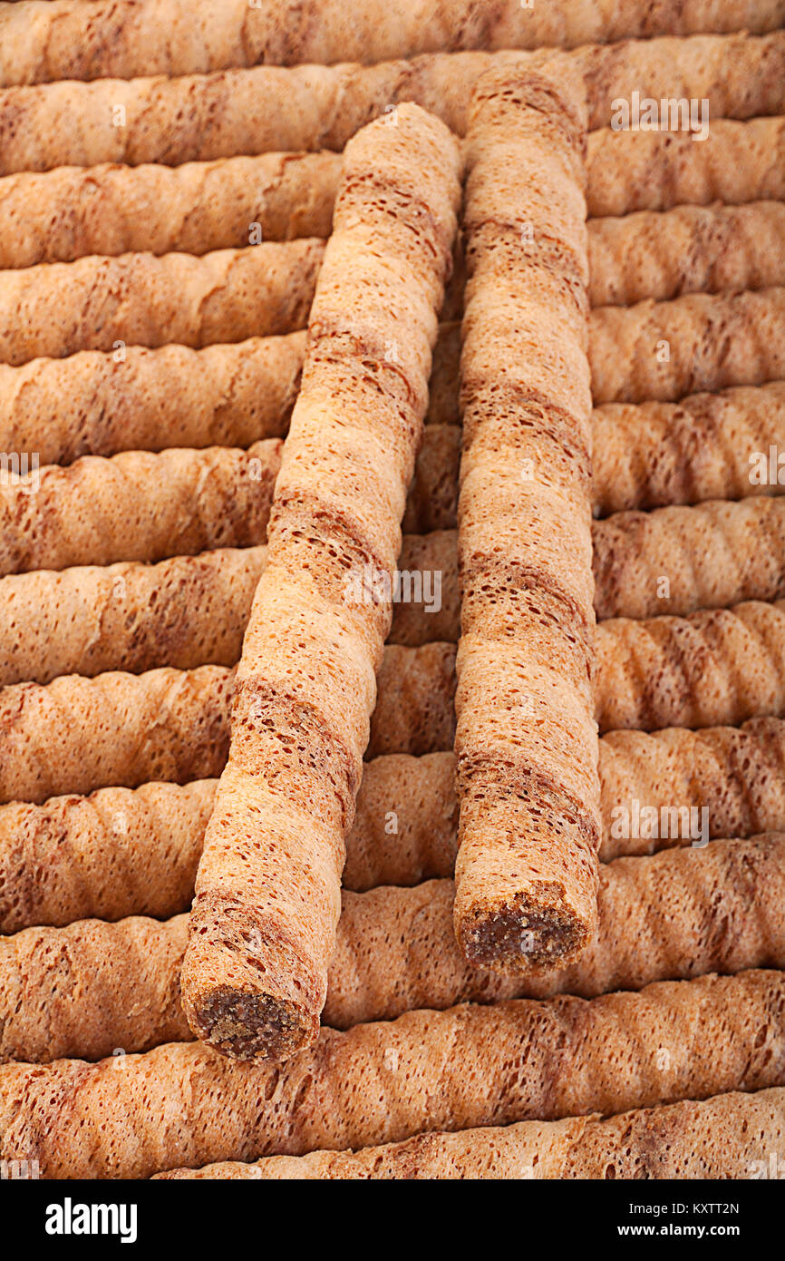 Waffle chocolate rolls stick closeup background Stock Photo - Alamy