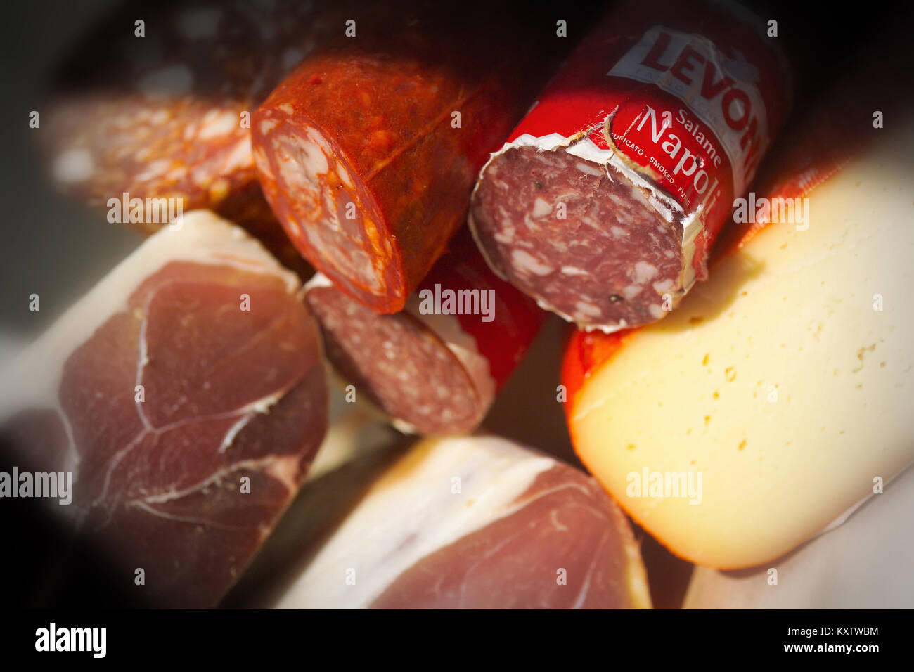 Thin sliced cured ham and Salami Stock Photo - Alamy