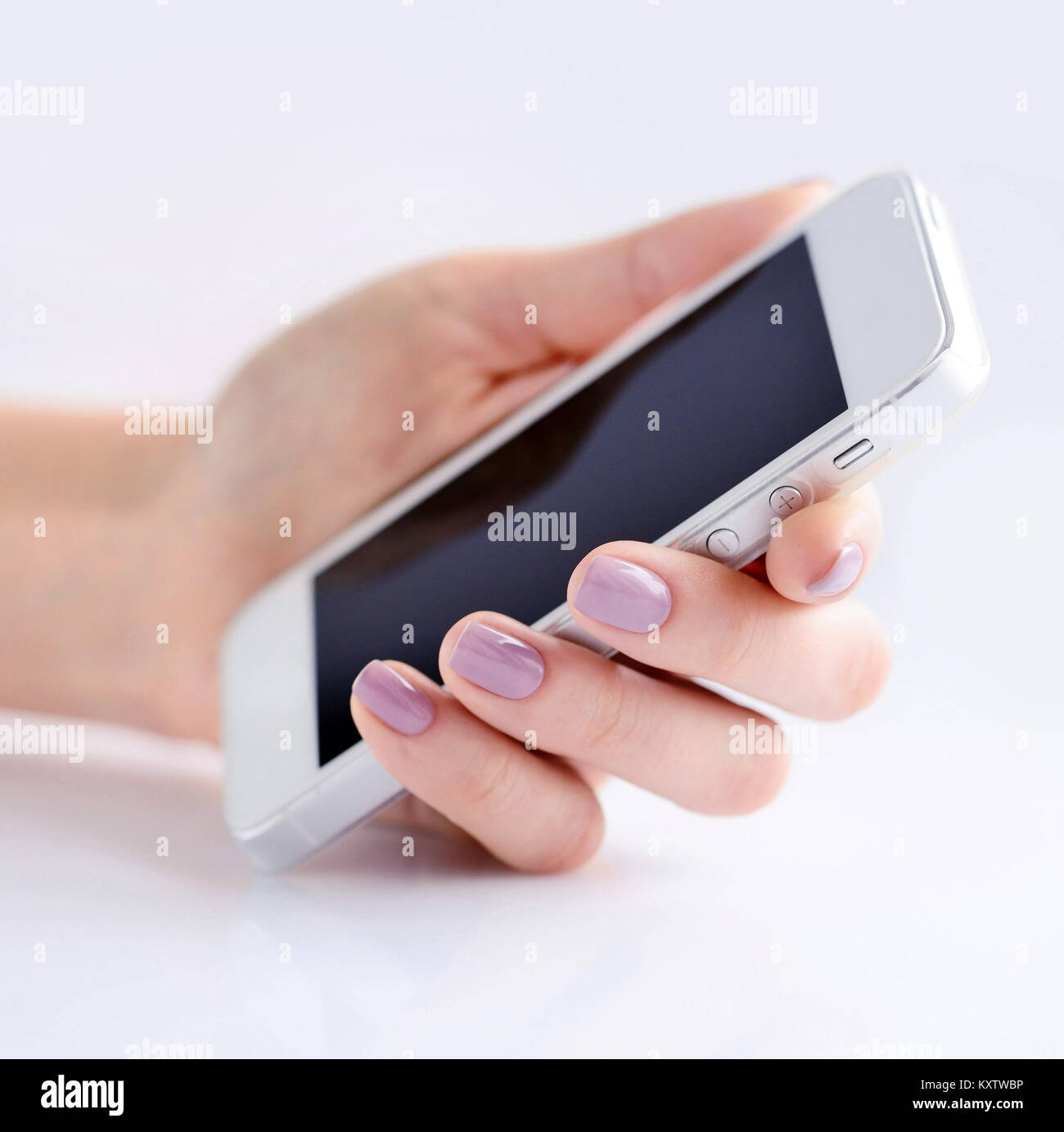 Mobile phone in female hand Stock Photo - Alamy