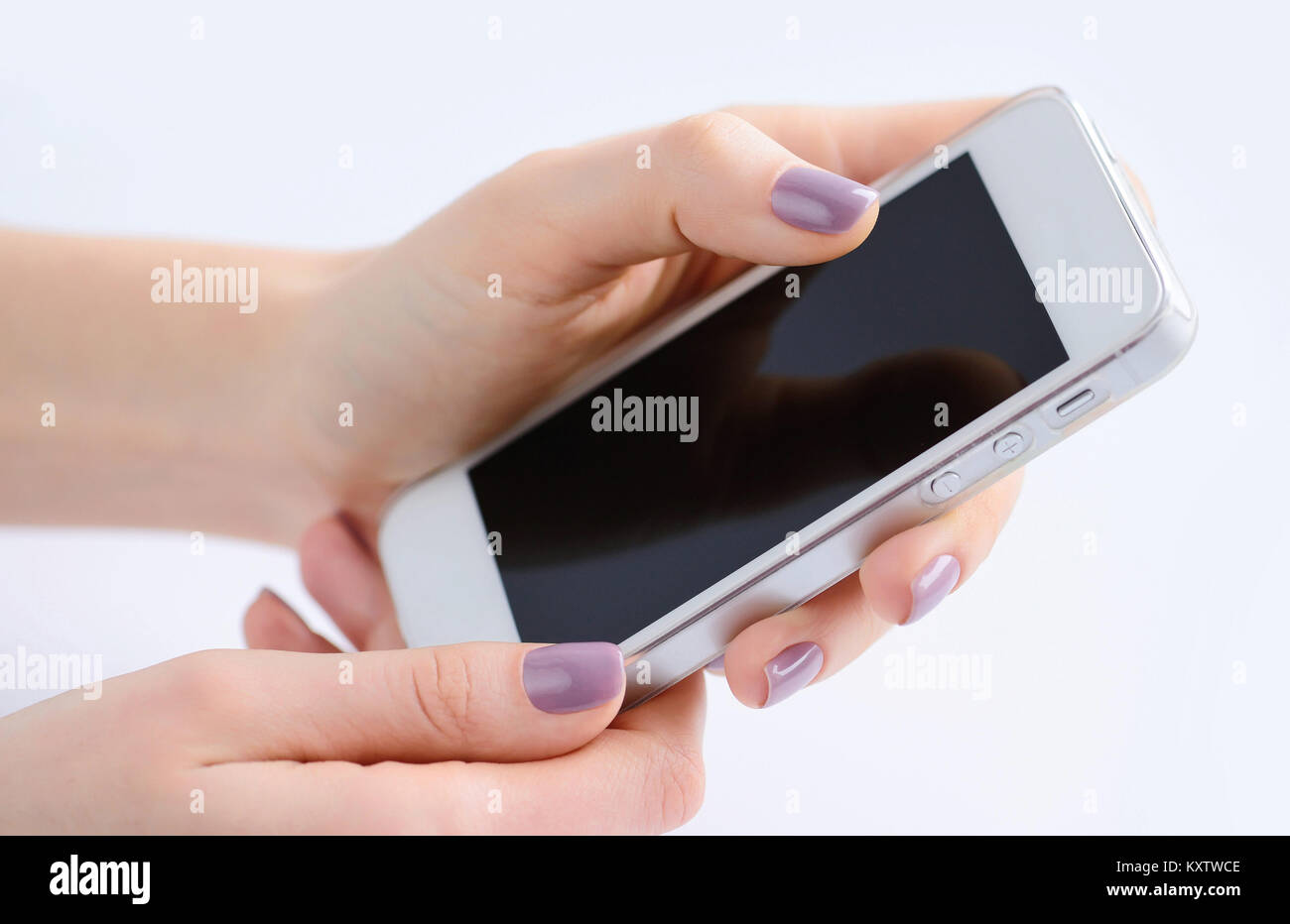 Women's hands holding mobile phone, fingers touching the screen Stock ...
