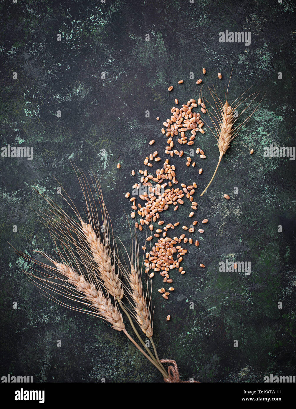 Wheat grains and spikelets on rusty background Stock Photo - Alamy