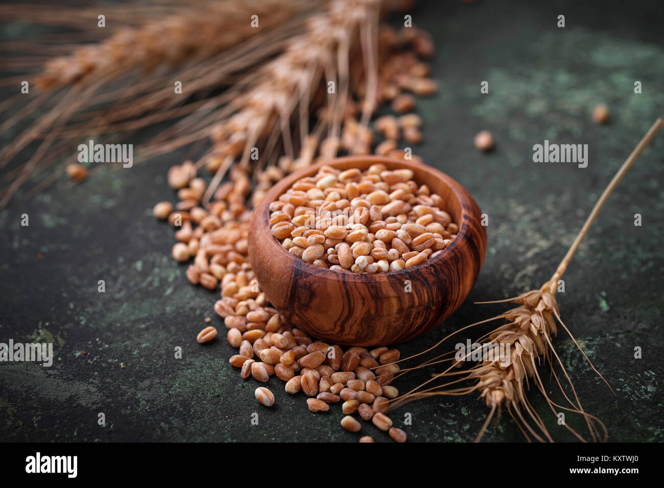Wheat grains and spikelets on rusty background Stock Photo - Alamy