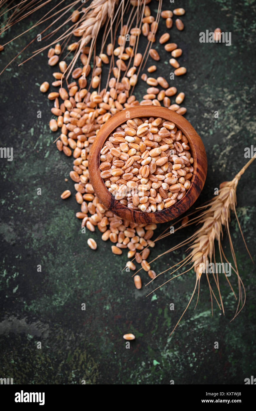 Wheat grains and spikelets on rusty background Stock Photo - Alamy