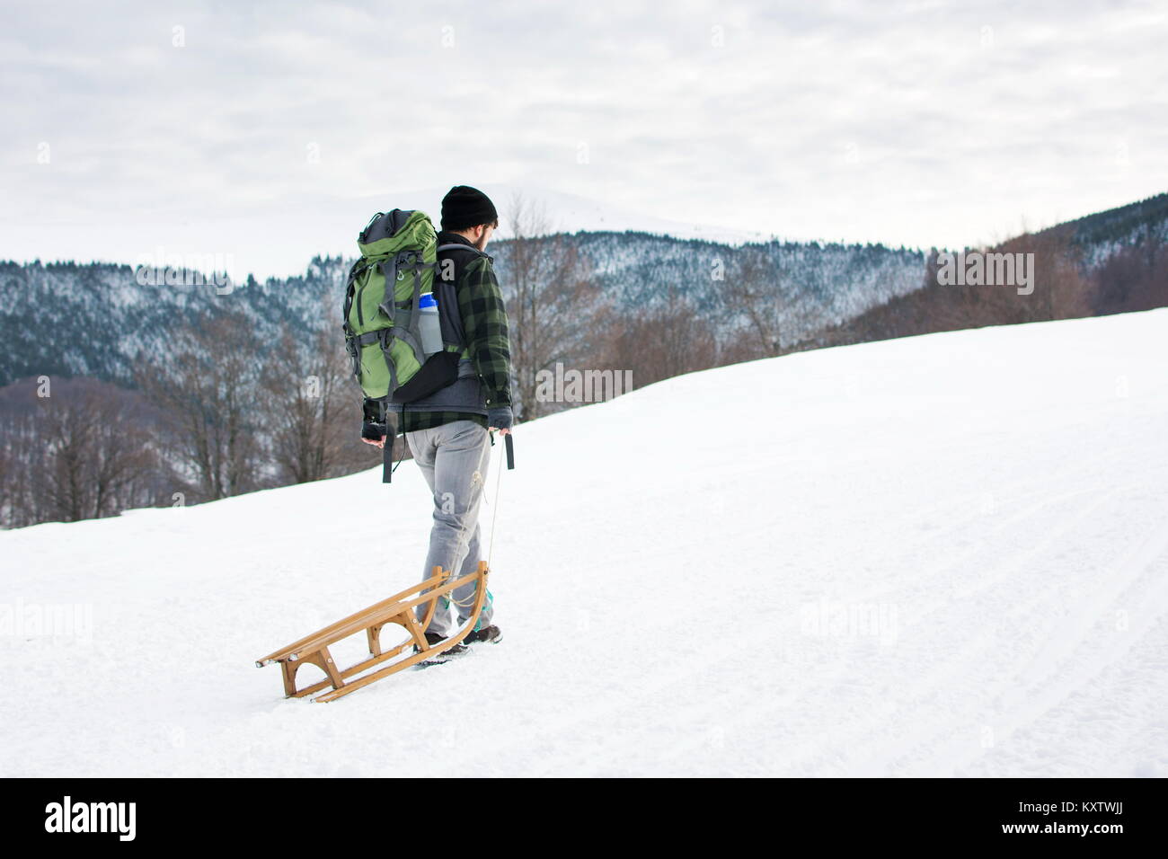 Pulling sled uphill hi-res stock photography and images - Alamy