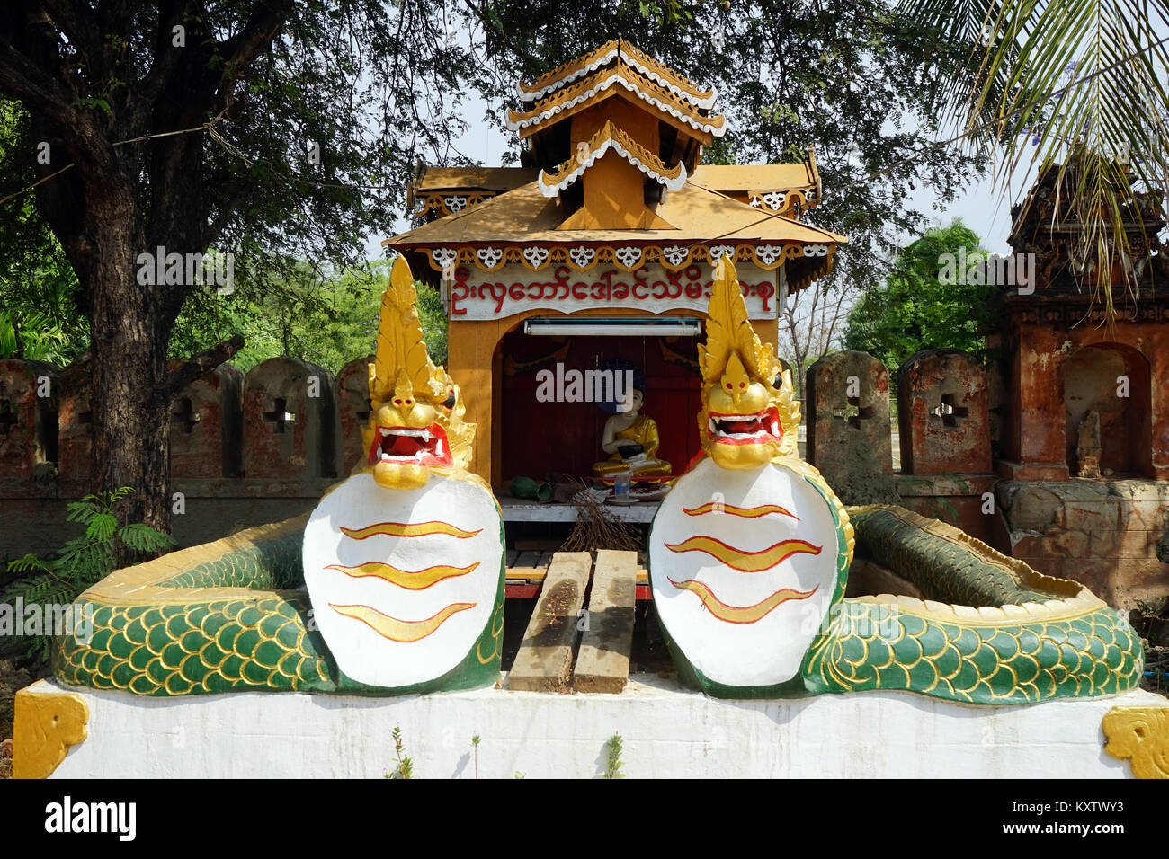 MANDALAY, MYANMAR - CIRCA APRIL 2017 Buddha and snakes in monastery on ...