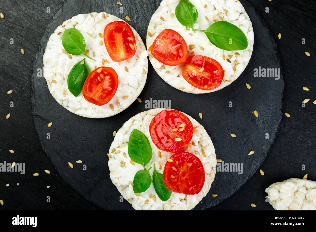 Healthy Rice Cakes with cherry tomatoes, cheese feta, basil and sesame ...