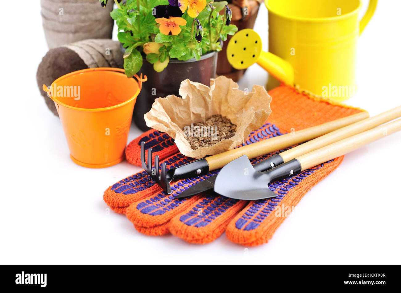 Gardening tools and seed and spring flowers on a white background Stock ...