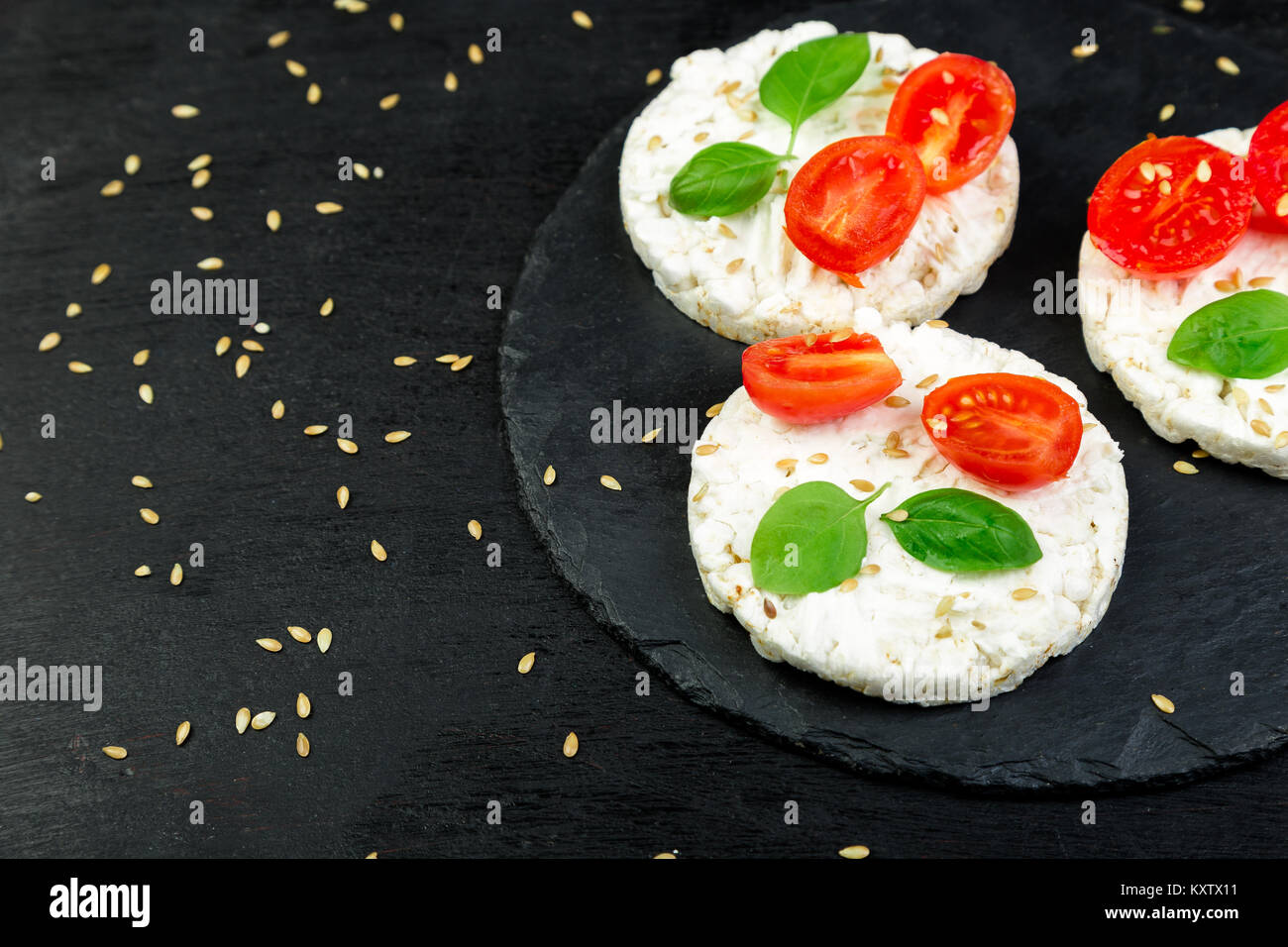 Healthy Rice Cakes with cherry tomatoes, cheese feta, basil and sesame ...