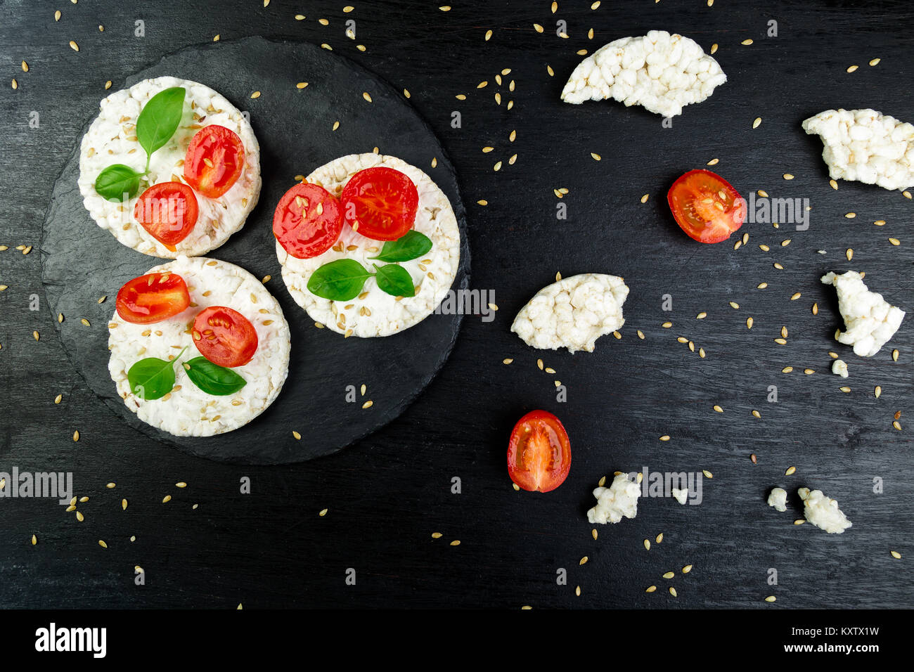 Healthy Rice Cakes with cherry tomatoes, cheese feta, basil and sesame ...