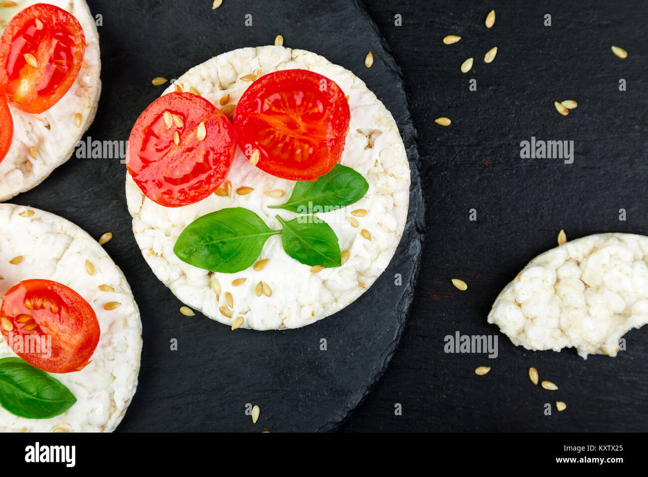 Healthy Rice Cakes with cherry tomatoes, cheese feta, basil and sesame ...