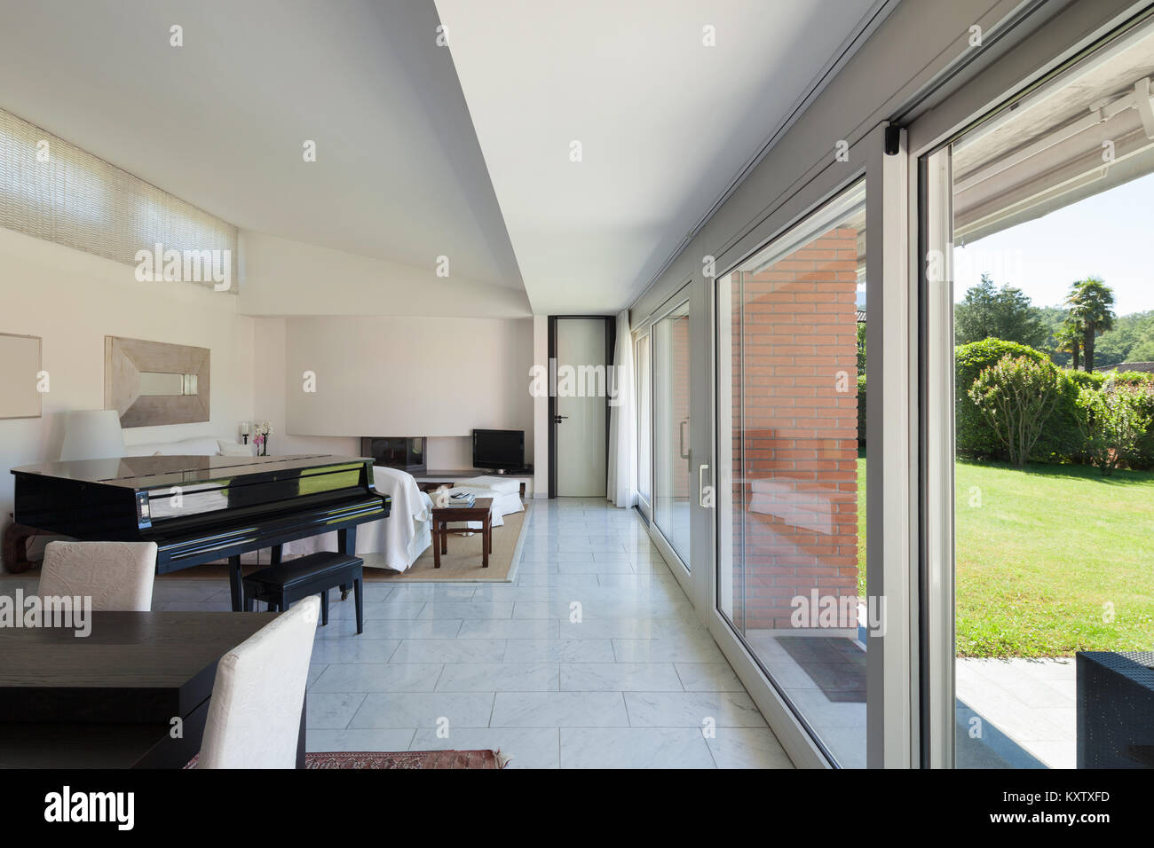 Lounge of a modern house, big windows, interior Stock Photo - Alamy