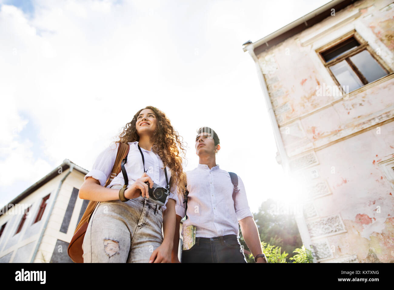 Two young tourists with camera in the old town Stock Photo - Alamy