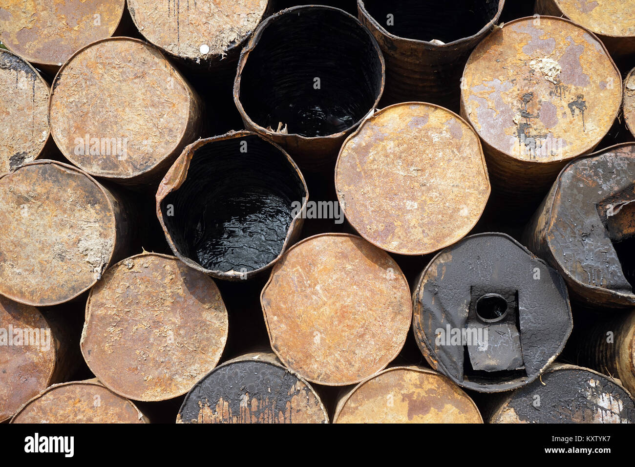 Rows of oil barrels in storage Stock Photo - Alamy