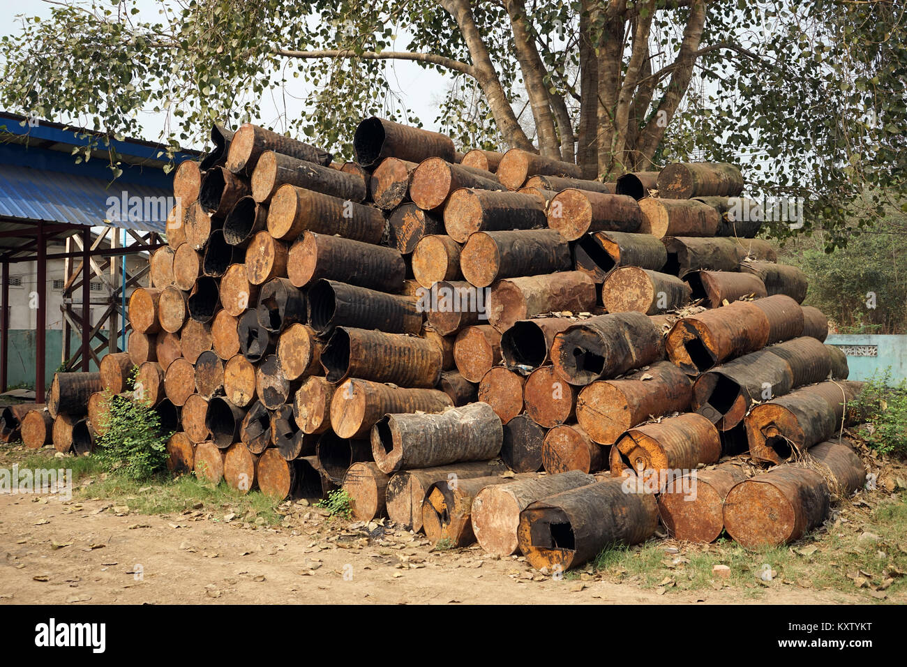 Heap of barrels under tree in the yard Stock Photo - Alamy