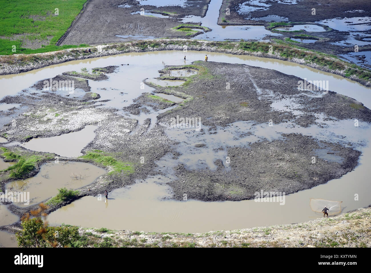 Big pond with water and fisherman Stock Photo - Alamy