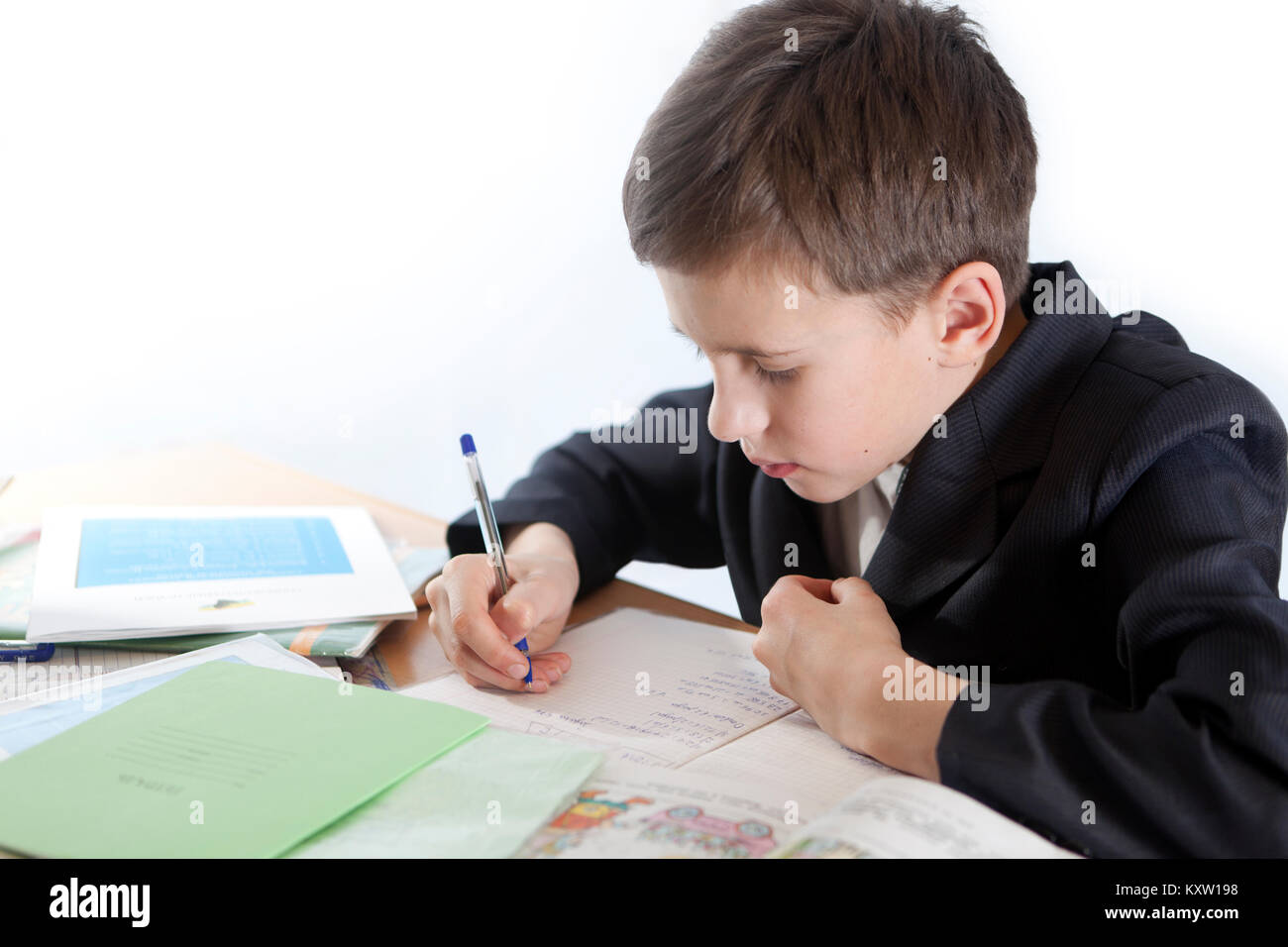 Schoolboy doing homework Stock Photo - Alamy
