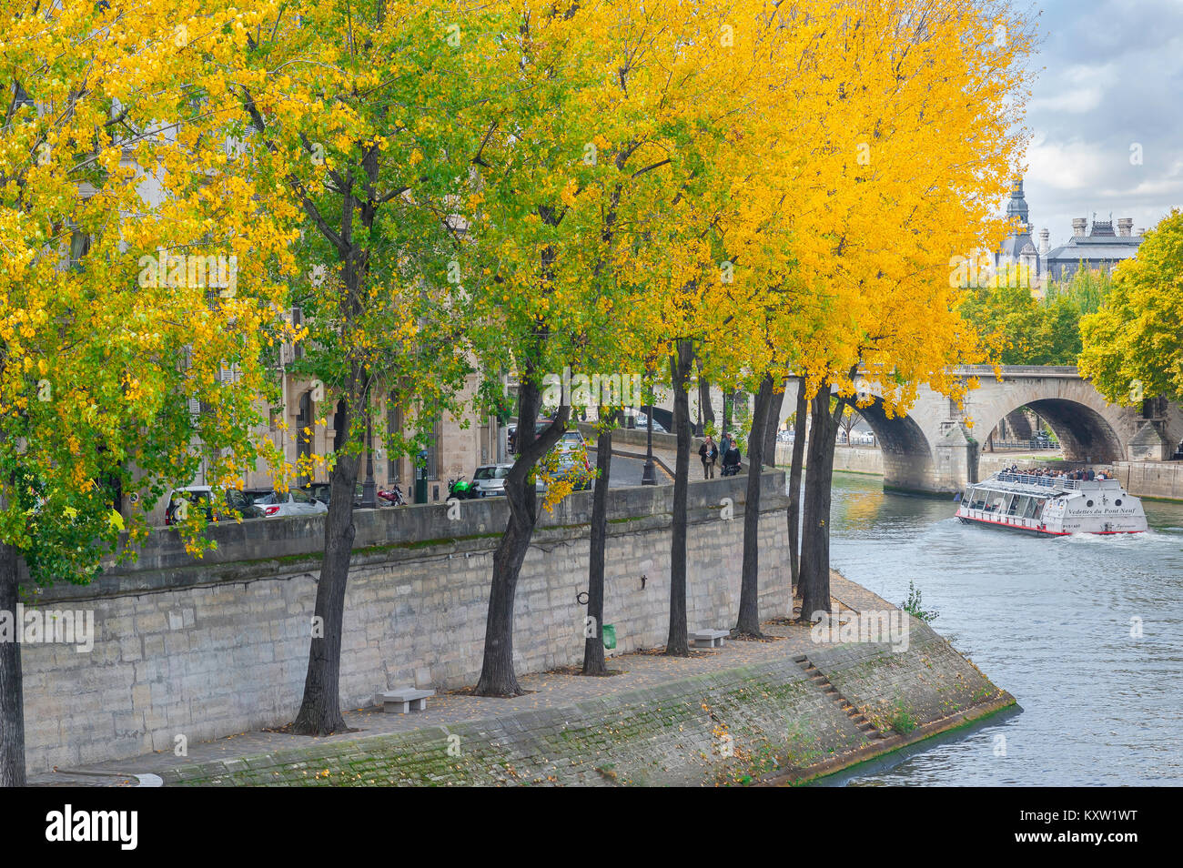 Autumn Paris, trees with colourful autumn foliage line an embankment ...